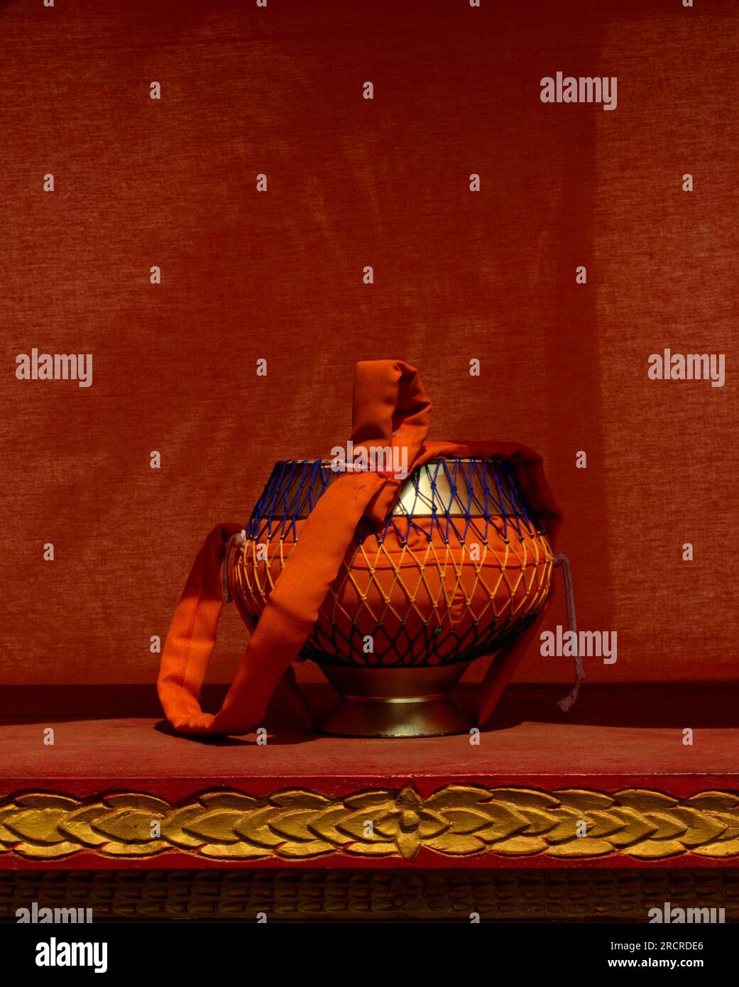 Attribute of Thai Buddhist monk, offering container. Dominant orange ...