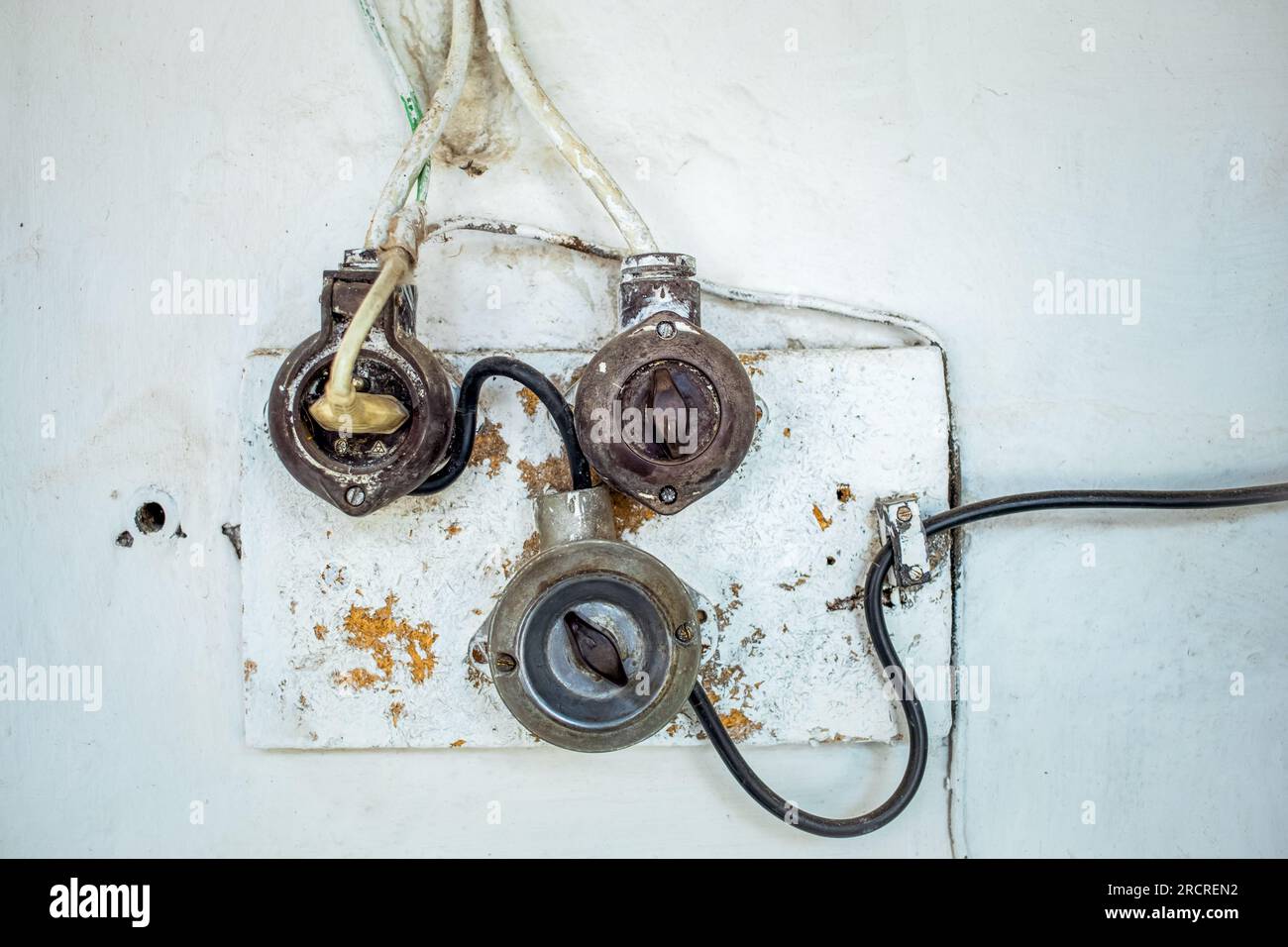 Vintage old light switch on a wooden frame with scratches and dust ...