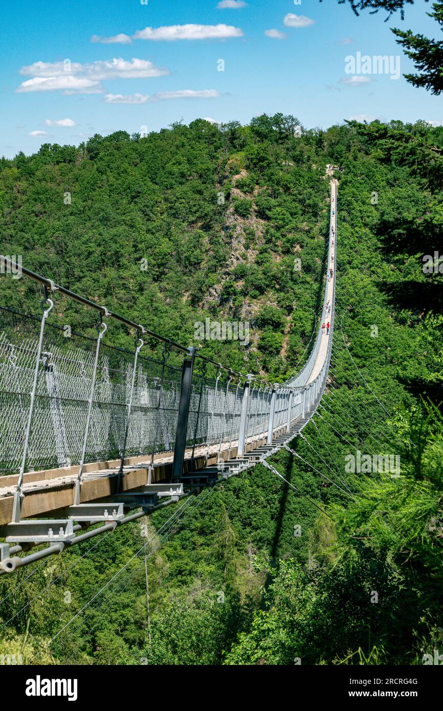 the longest suspension bridge in germany with people crossing the ...