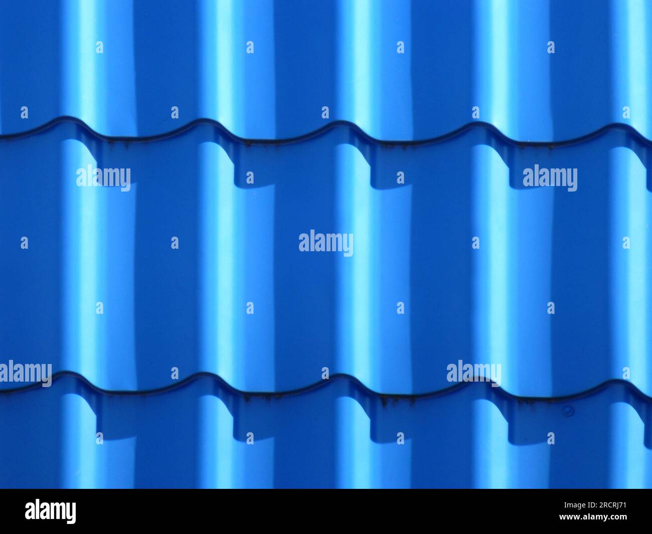 Brand new blue roofing from stainless metal plates Stock Photo - Alamy
