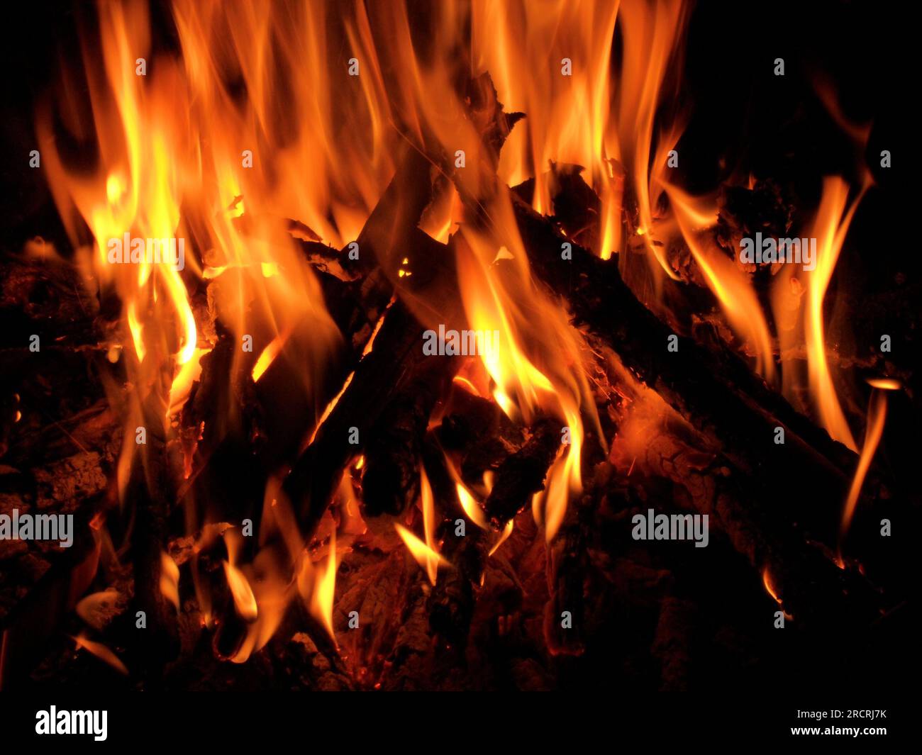 Shining dry burning wood in the fireplace with fire Stock Photo - Alamy