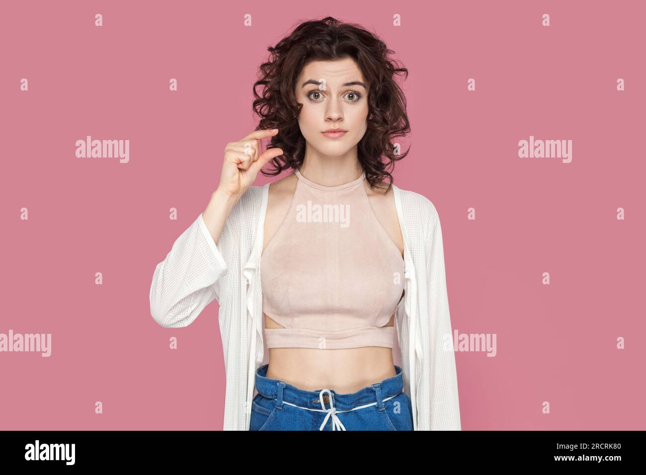 Portrait of confused disappointed beautiful woman with curly hairstyle ...