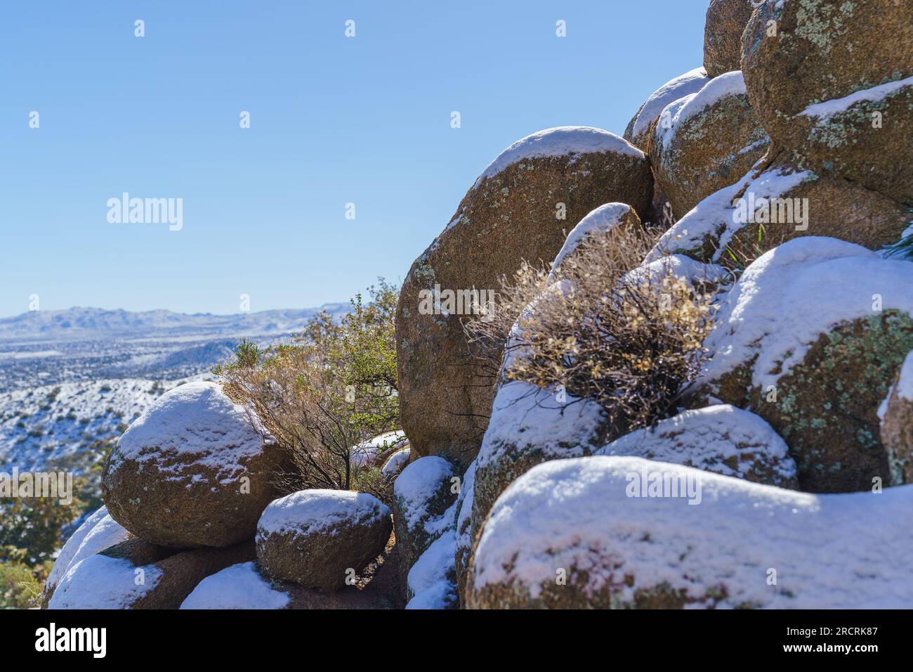 Snow on granite boulders in the desert of Joshua Tree, California Stock ...