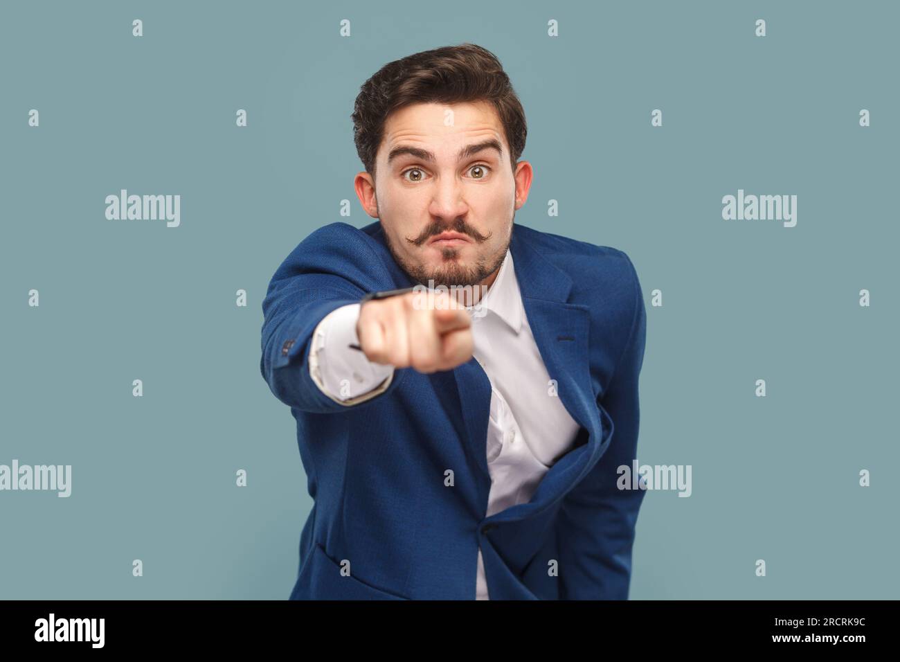 Portrait of serious man with mustache with negative facial expression ...