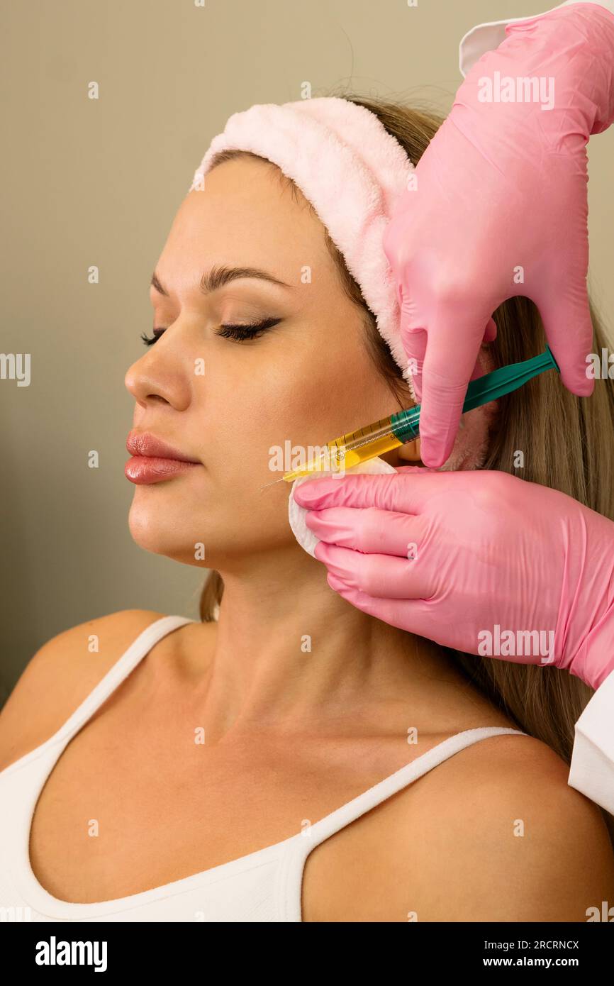 Esthetician uses thin needle to inject Platelet-Rich Plasma in skin ...