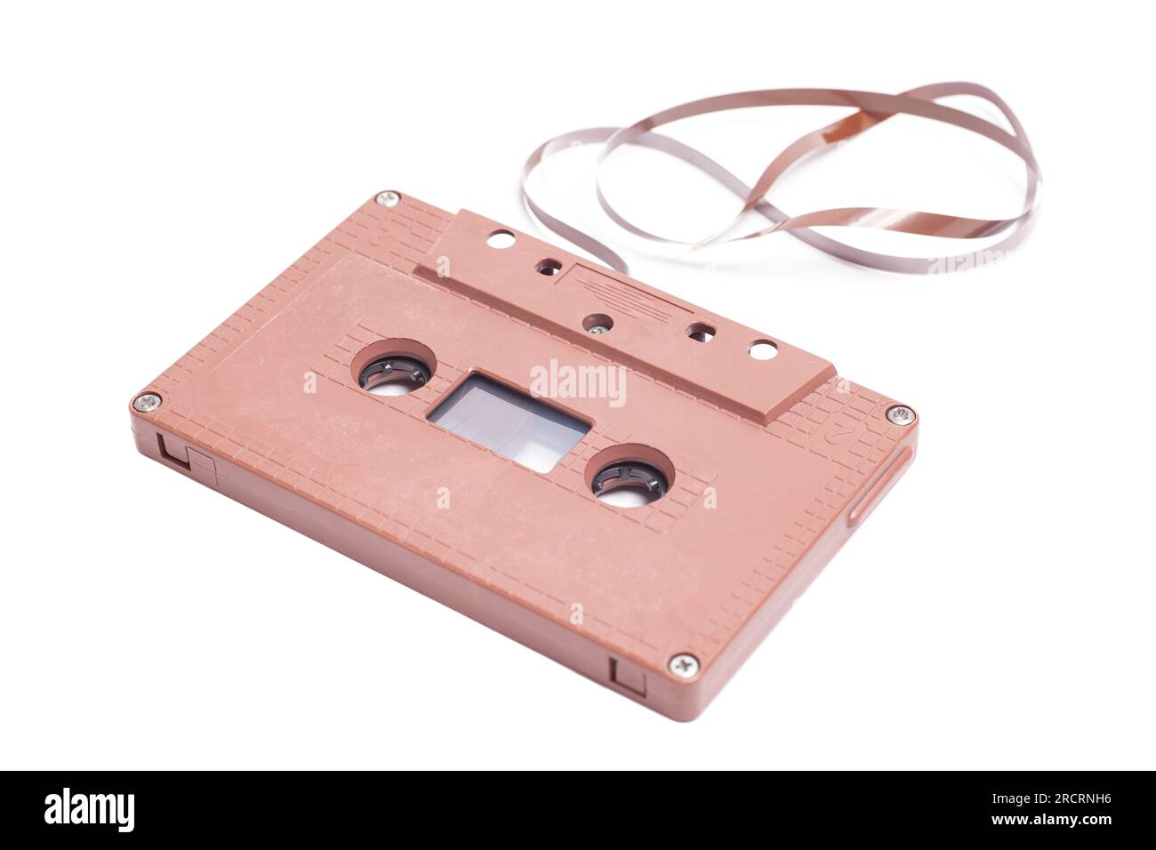 Audio cassette with pulled out audiotape isolated on white background ...