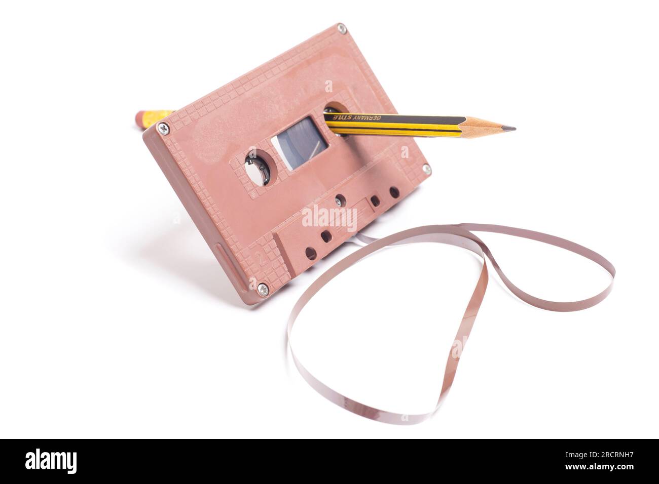 Audio cassette tape with pencil isolated on white background, vintage ...