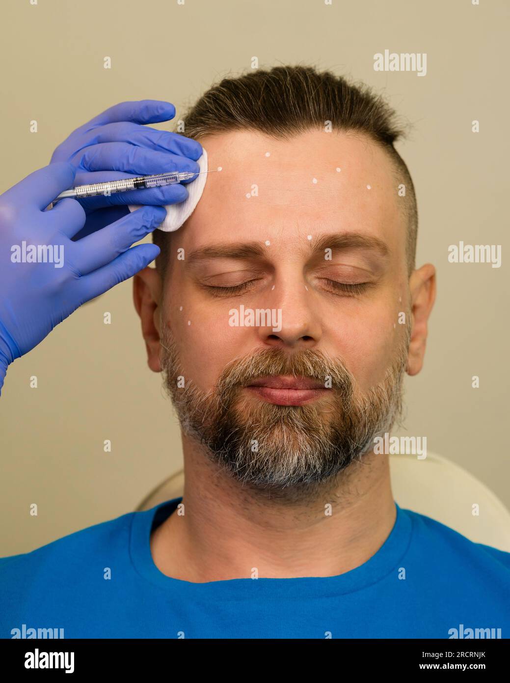 Beautician making botulinum toxin injections to male patient. Beauty ...