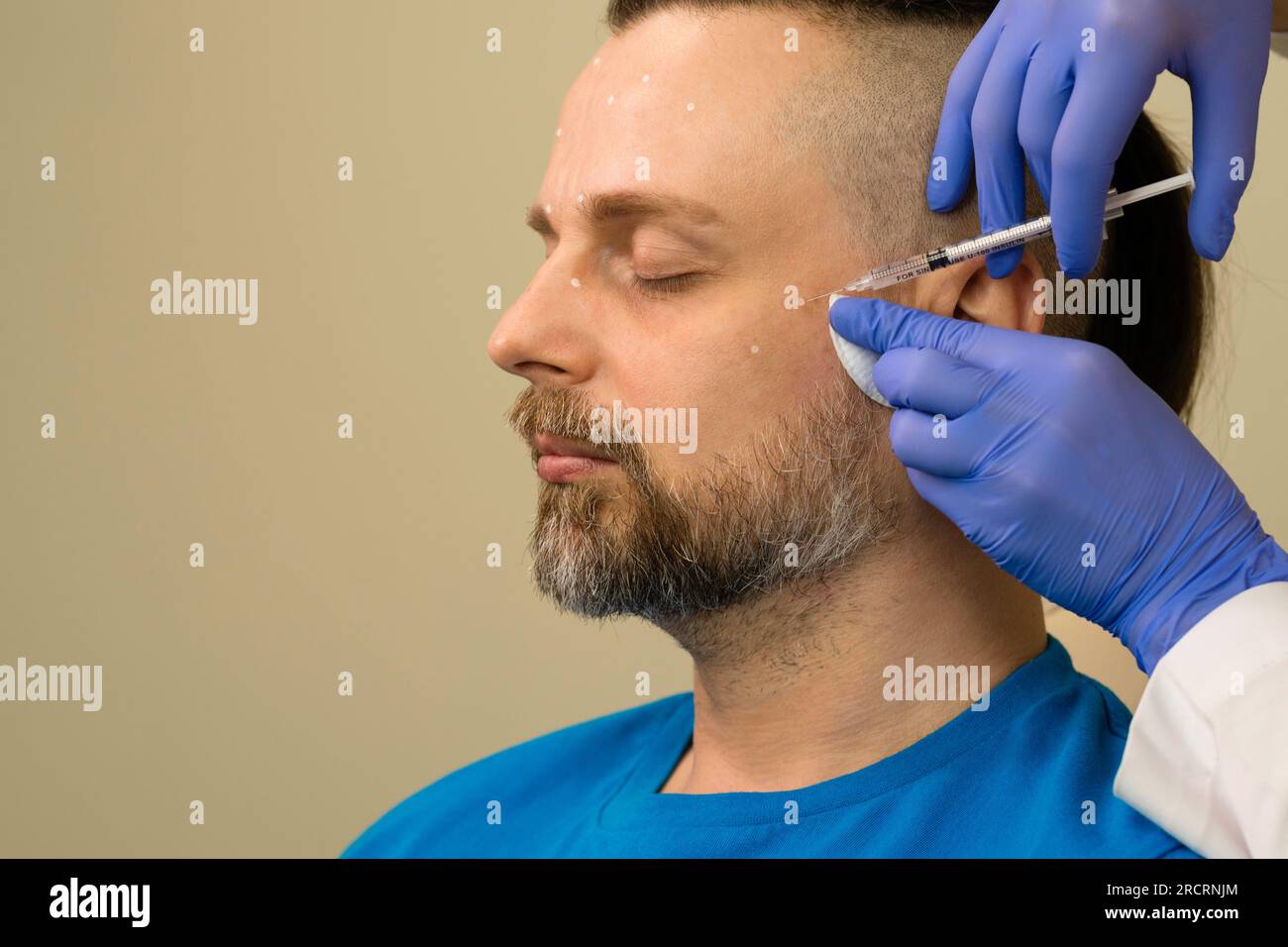 Beautician making botulinum toxin injections to male patient. Beauty ...