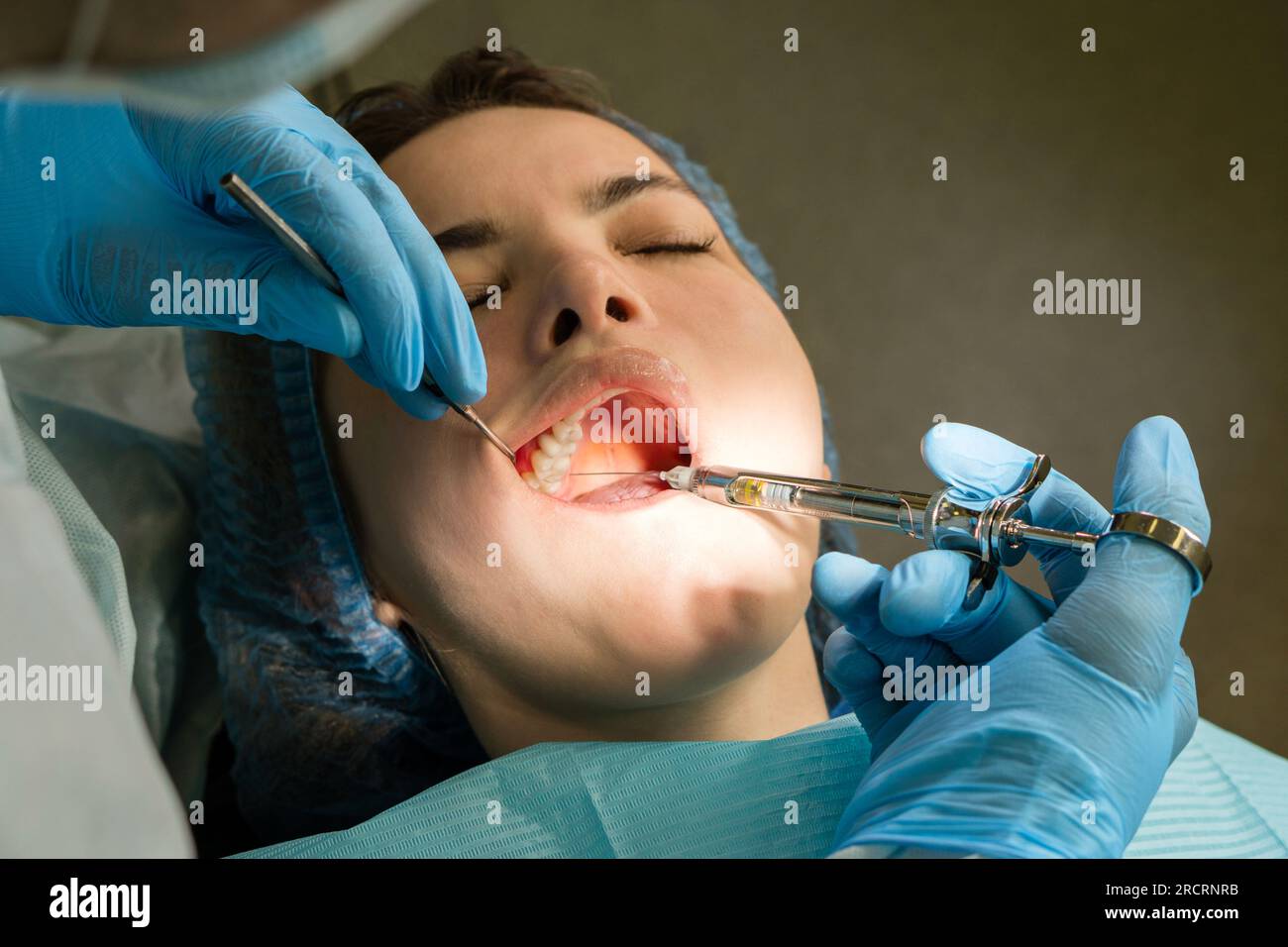 Dental Surgeon Performs Conduction Anesthesia With Lidocaine Using A