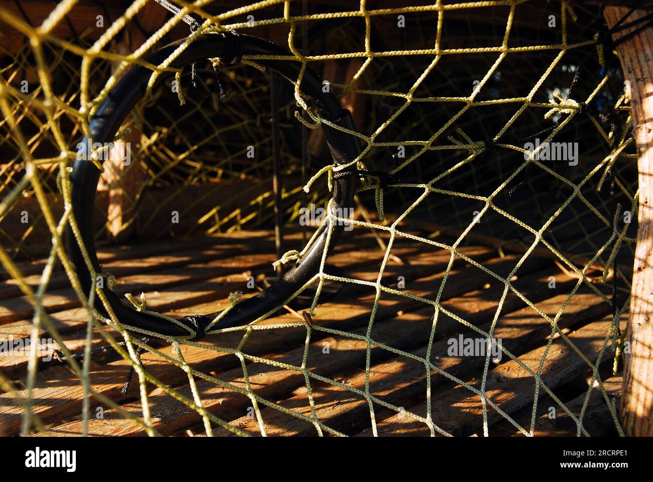 Details of the netting of a lobster trap as seen on the docks of a New ...