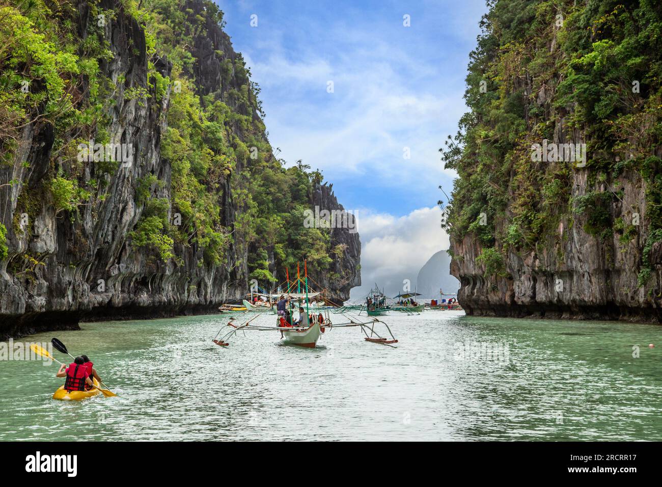 Traffic jam with lot of tourist boats in big lagoon. El Nido, Palawan ...