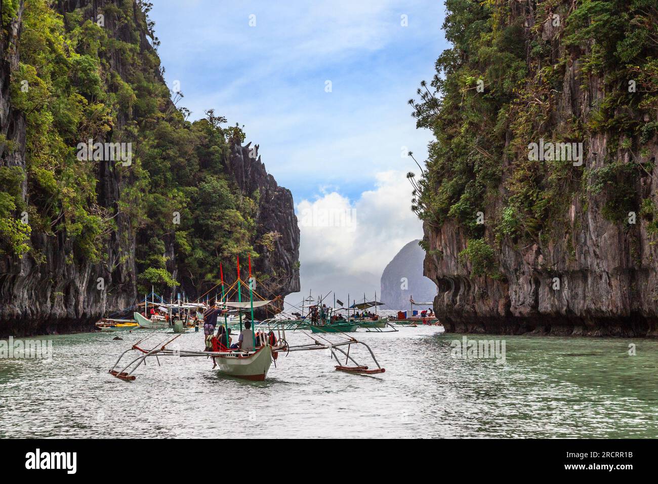 Traffic jam with lot of tourist boats in big lagoon. El Nido, Palawan ...