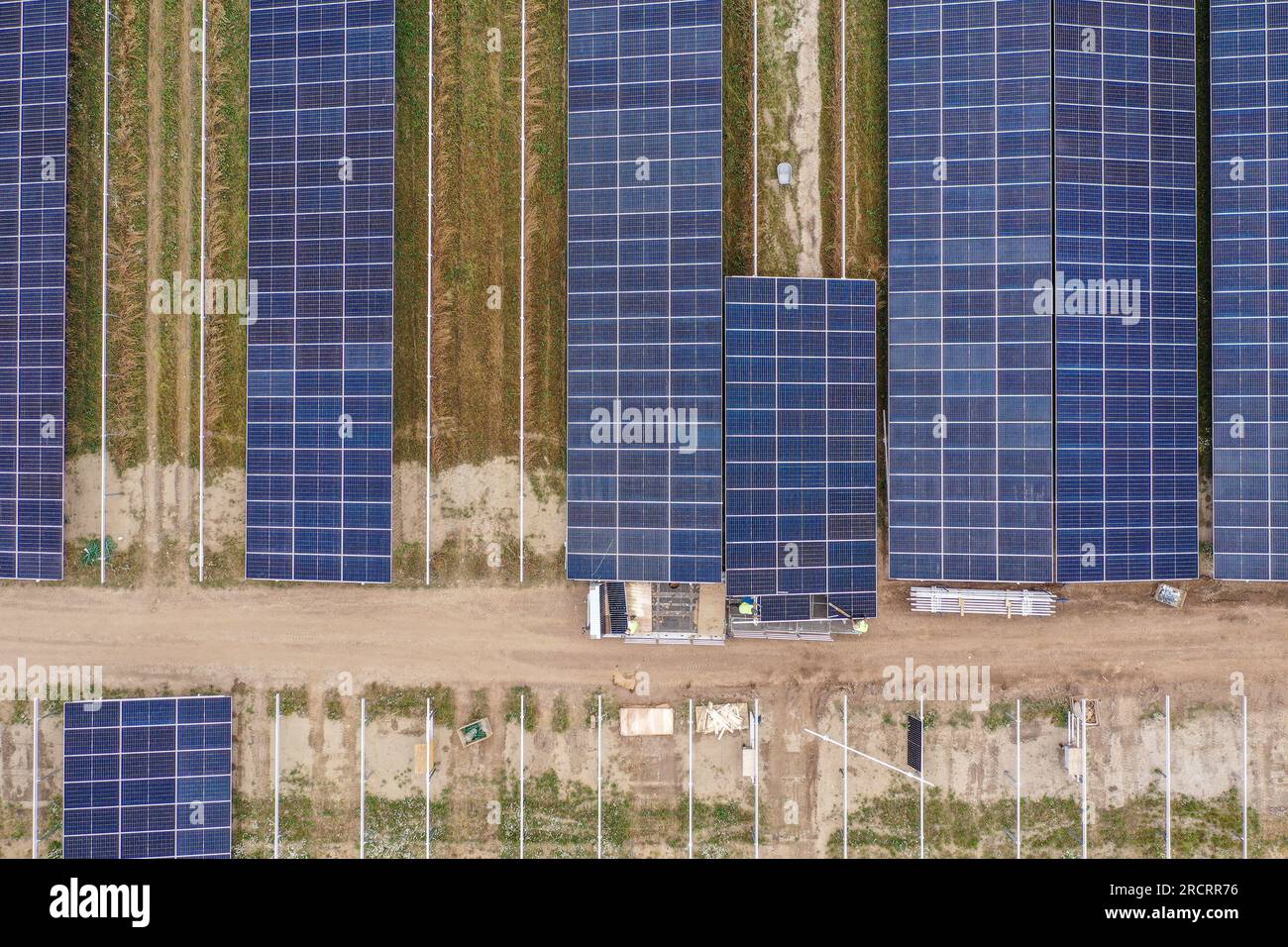 05 July 2023, Saxony, Neukieritzsch: Workers assemble solar panels at ...