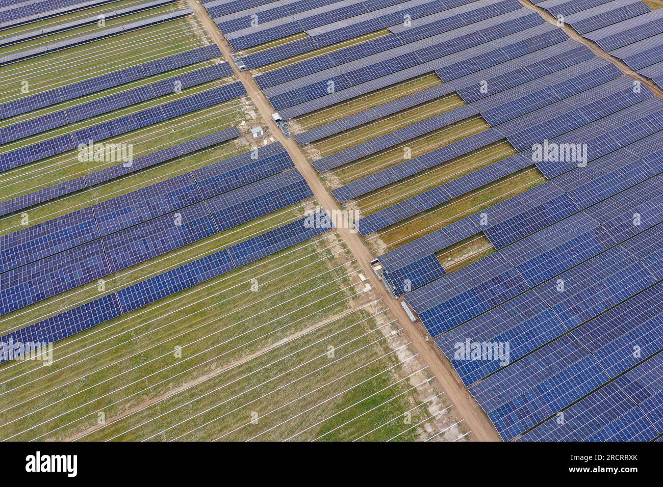 05 July 2023, Saxony, Neukieritzsch: Workers assemble solar panels at ...