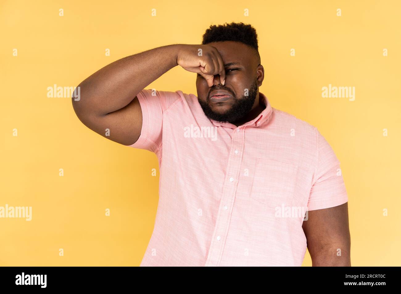 What is a bad small. Portrait of man pinching nose, stop breathing bad ...