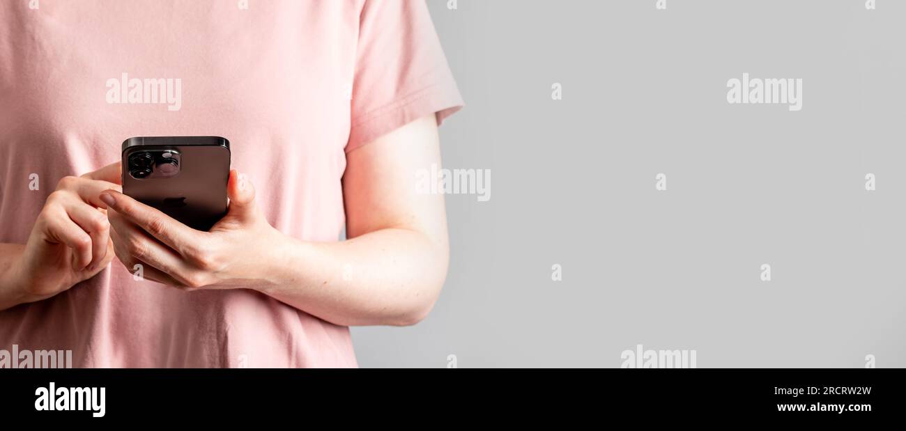 Berlin, Germany June 15 2023 Hand holding mobile phone, scrolling ...