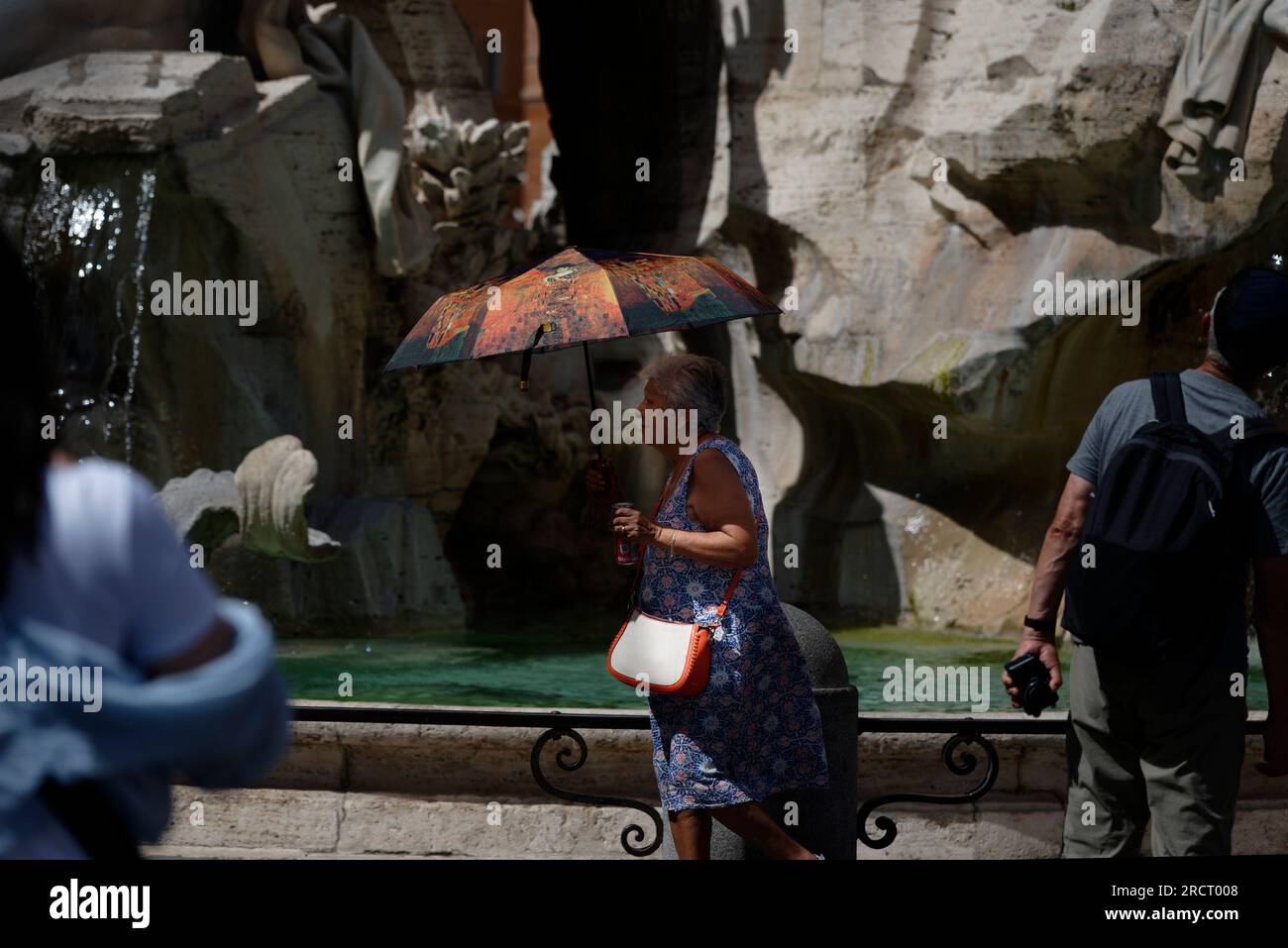 People cool off during an ongoing heat wave with temperatures reaching ...