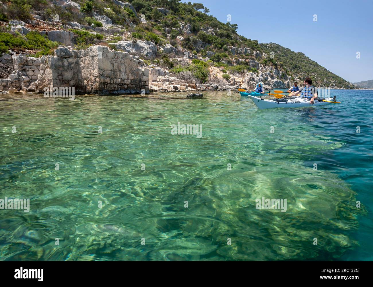 Kayakers stop to admire a section of the Sunken City of Simena ruins on ...