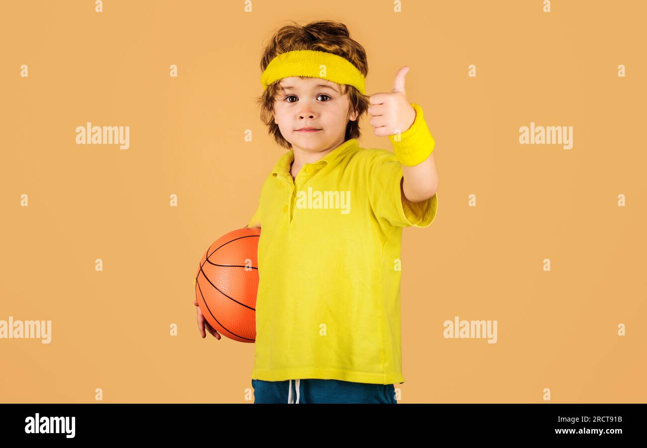 Active sport lifestyle. Basketball game. Little sporty kid with ...
