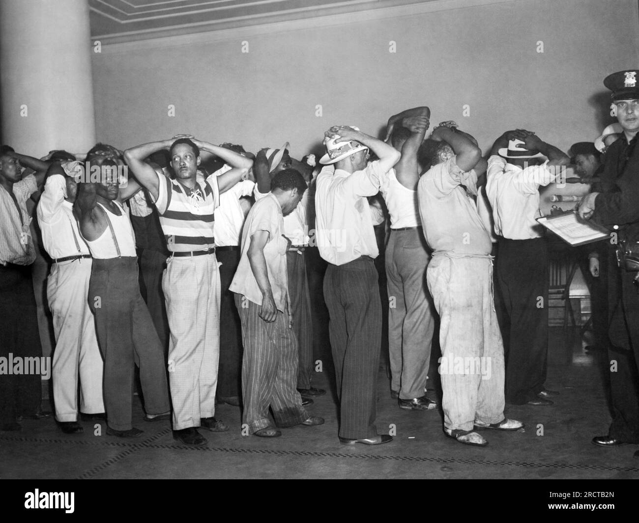 Detroit, Michigan: June 24, 1943 Blacks under arrest being booked into ...