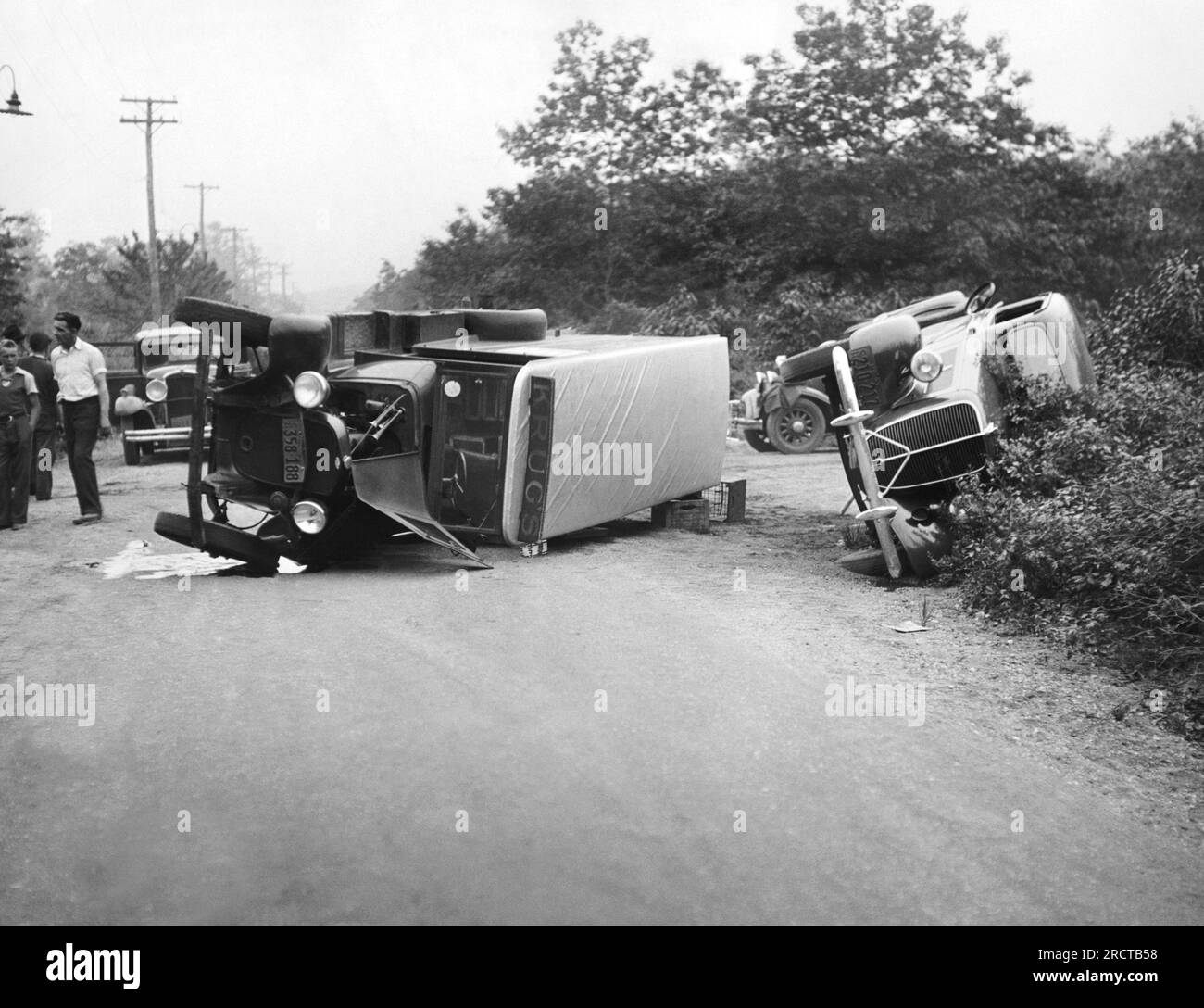 Long Island, New York: c. 1937 Two overturned vehicles after an ...