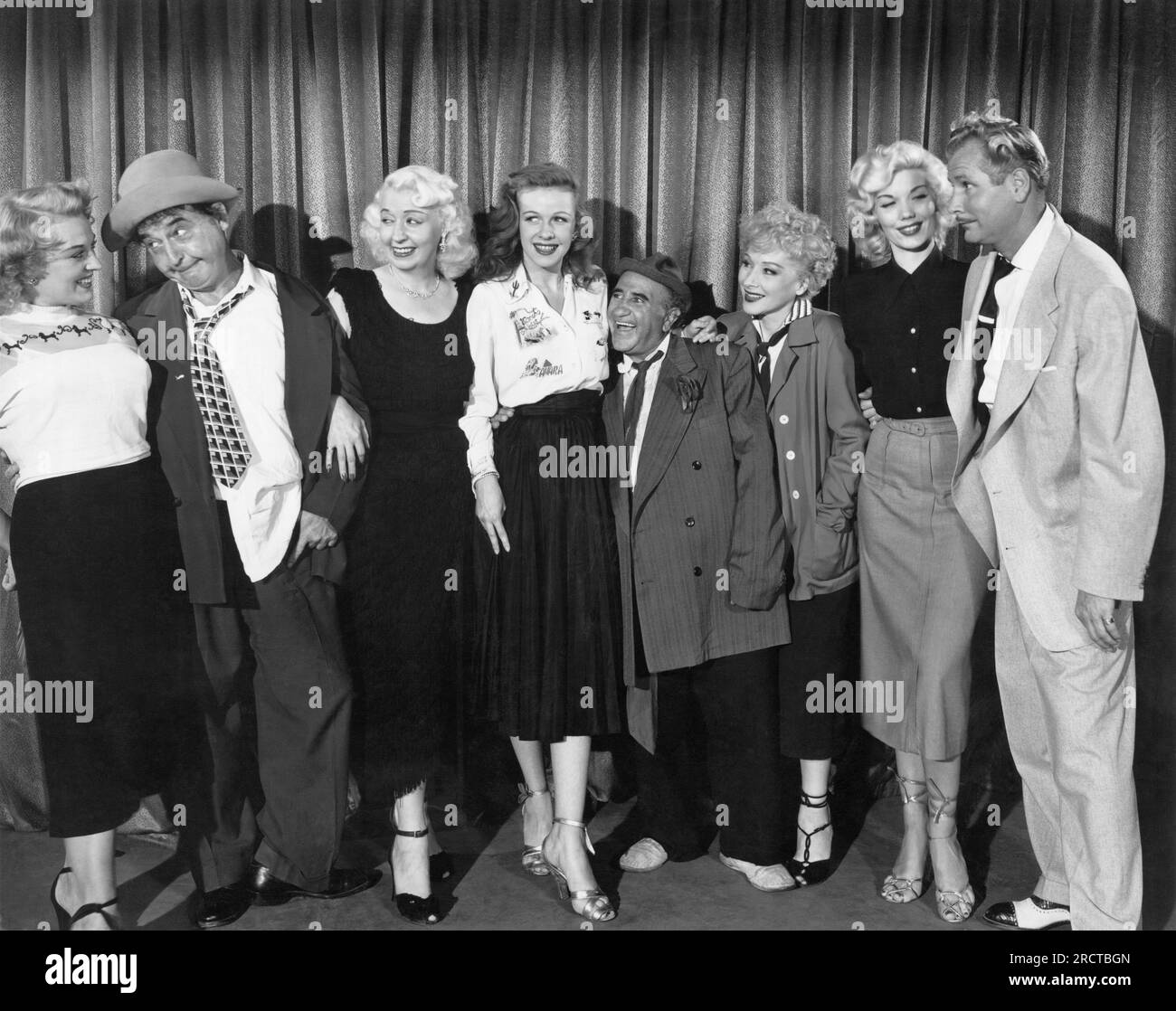 United States c. 1945 A theatrical gathering of men and women in ...