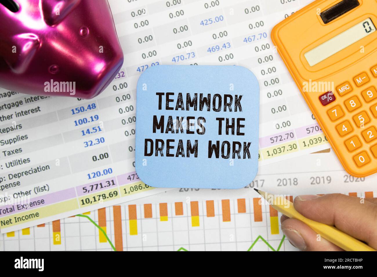 Concept words TMDW Teamwork makes dream work on white note on beautiful ...