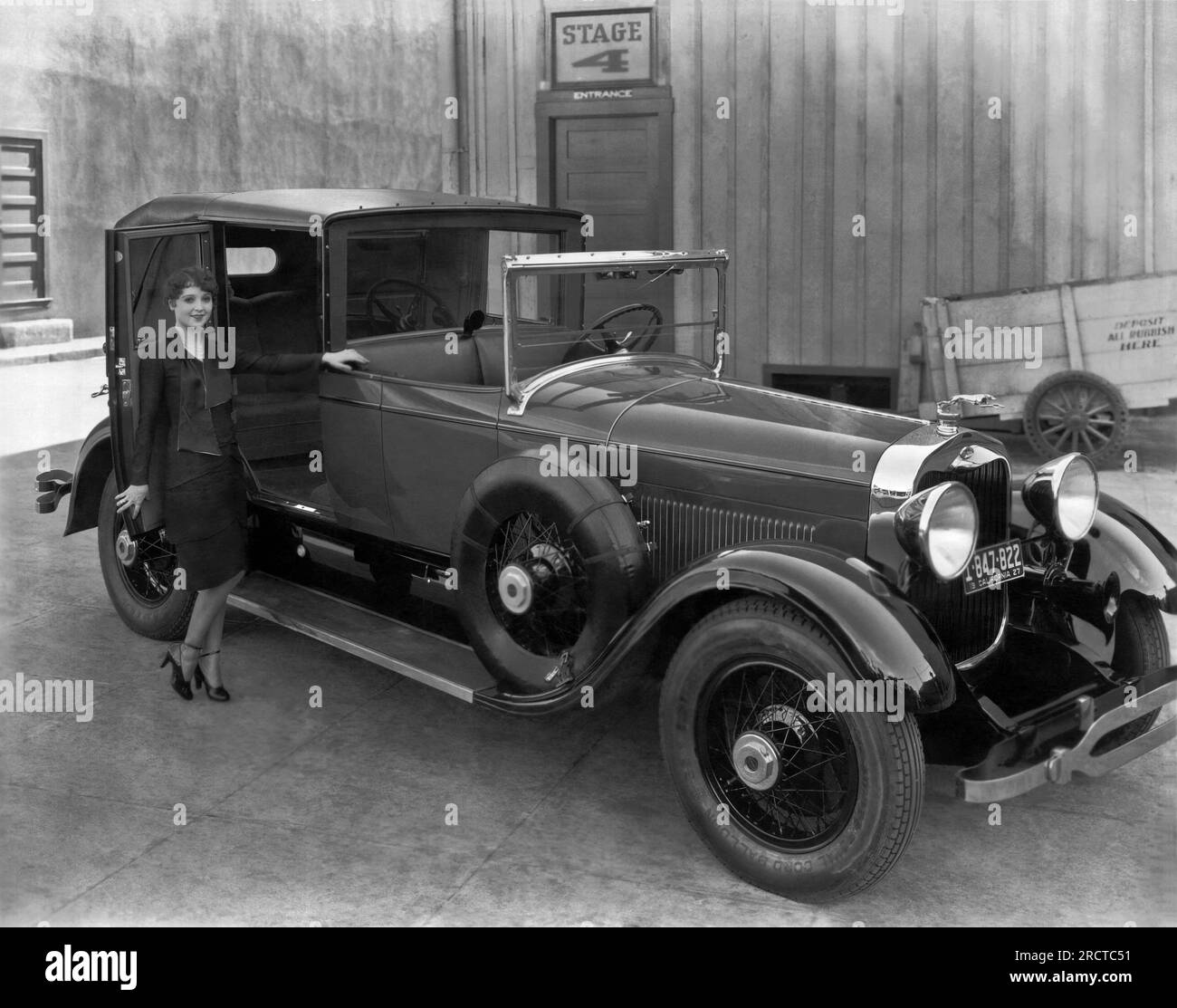 Hollywood, California: 1927. A young woman prepares to enter the rear ...