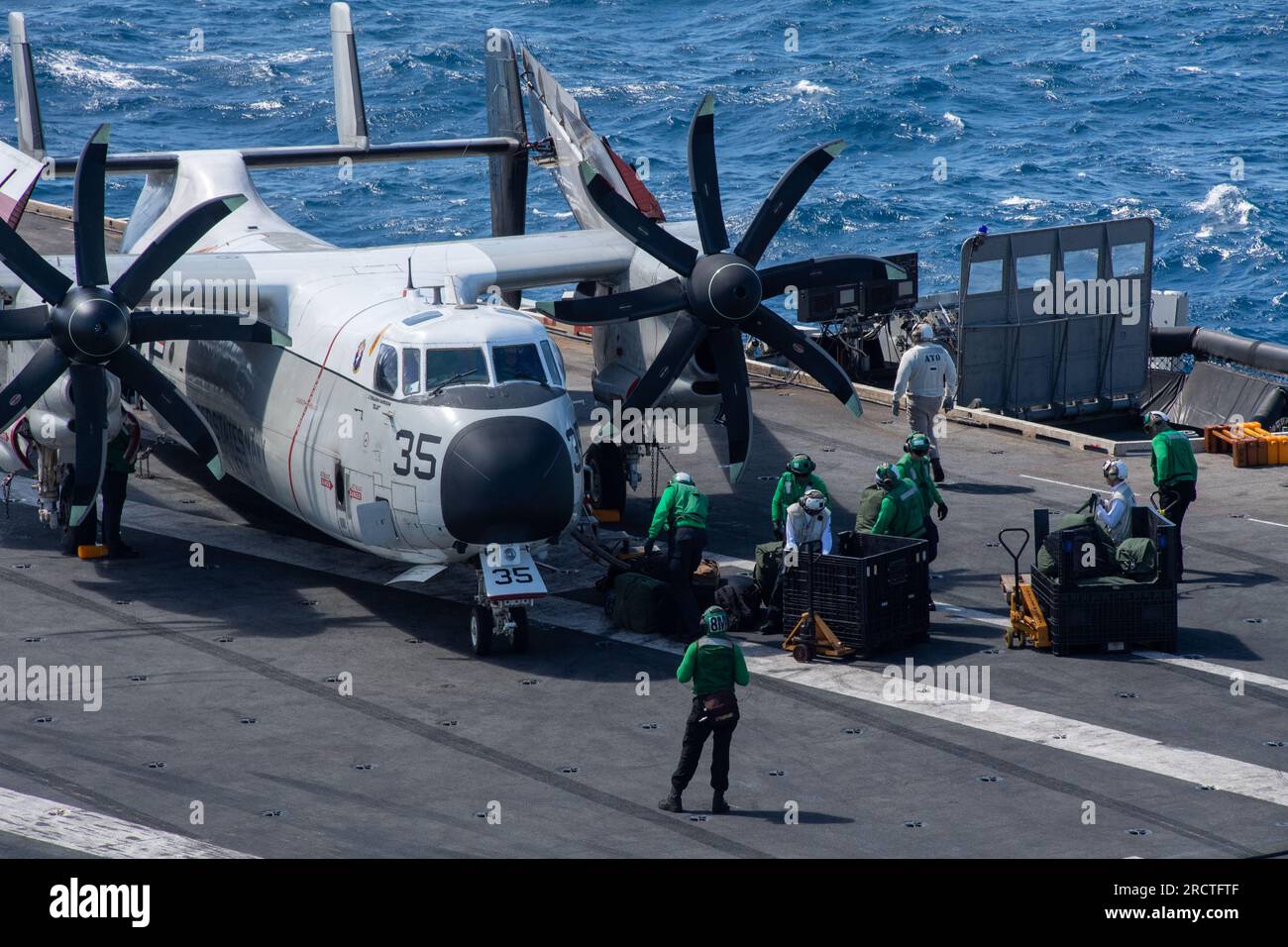 230712-N-BE723-1006 INDIAN OCEAN (July 12, 2023) Sailors load cargo ...