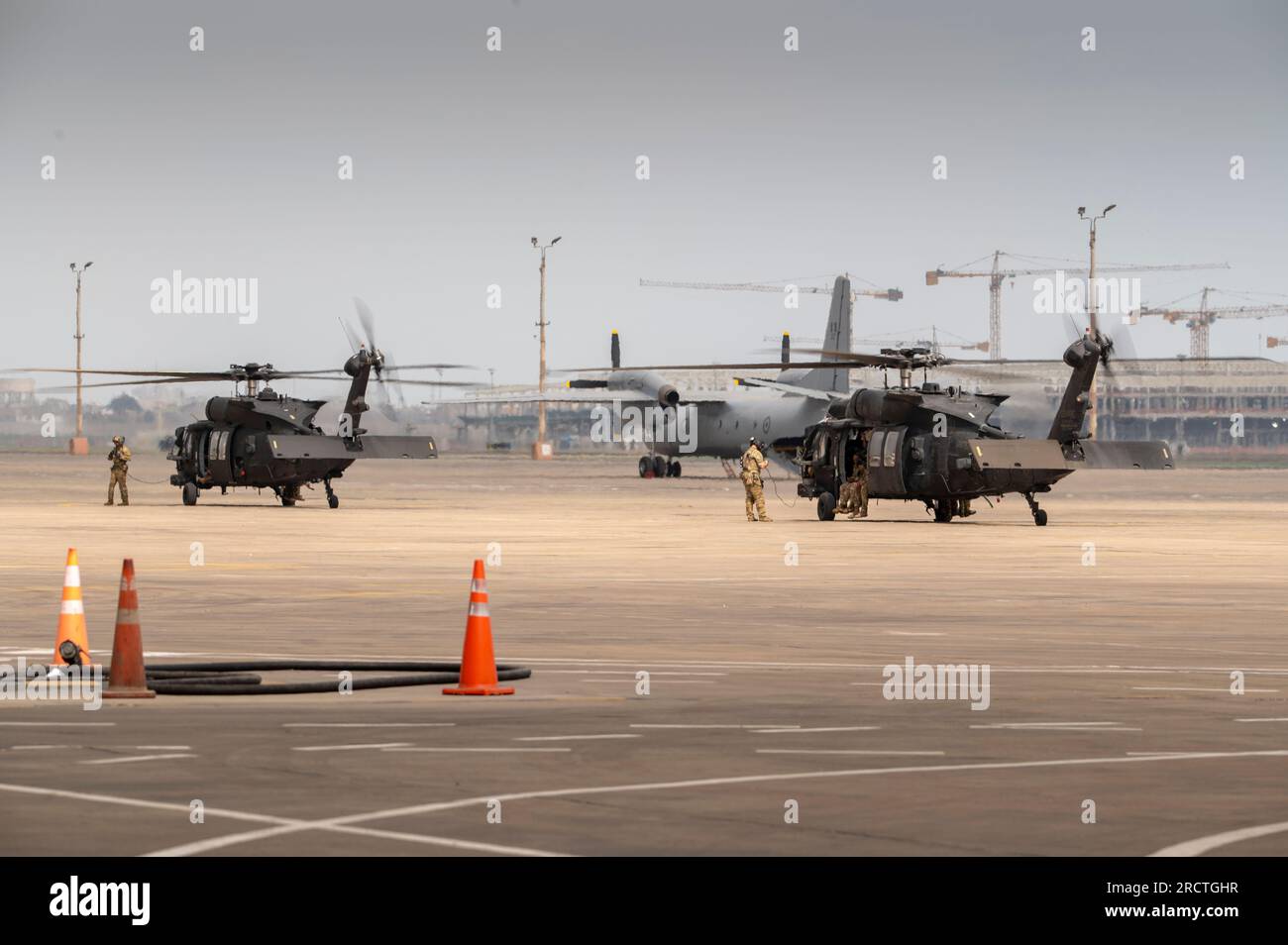 Two U.S. Army MH-60 Blackhawks await refueling, July 7, 2023, Base ...