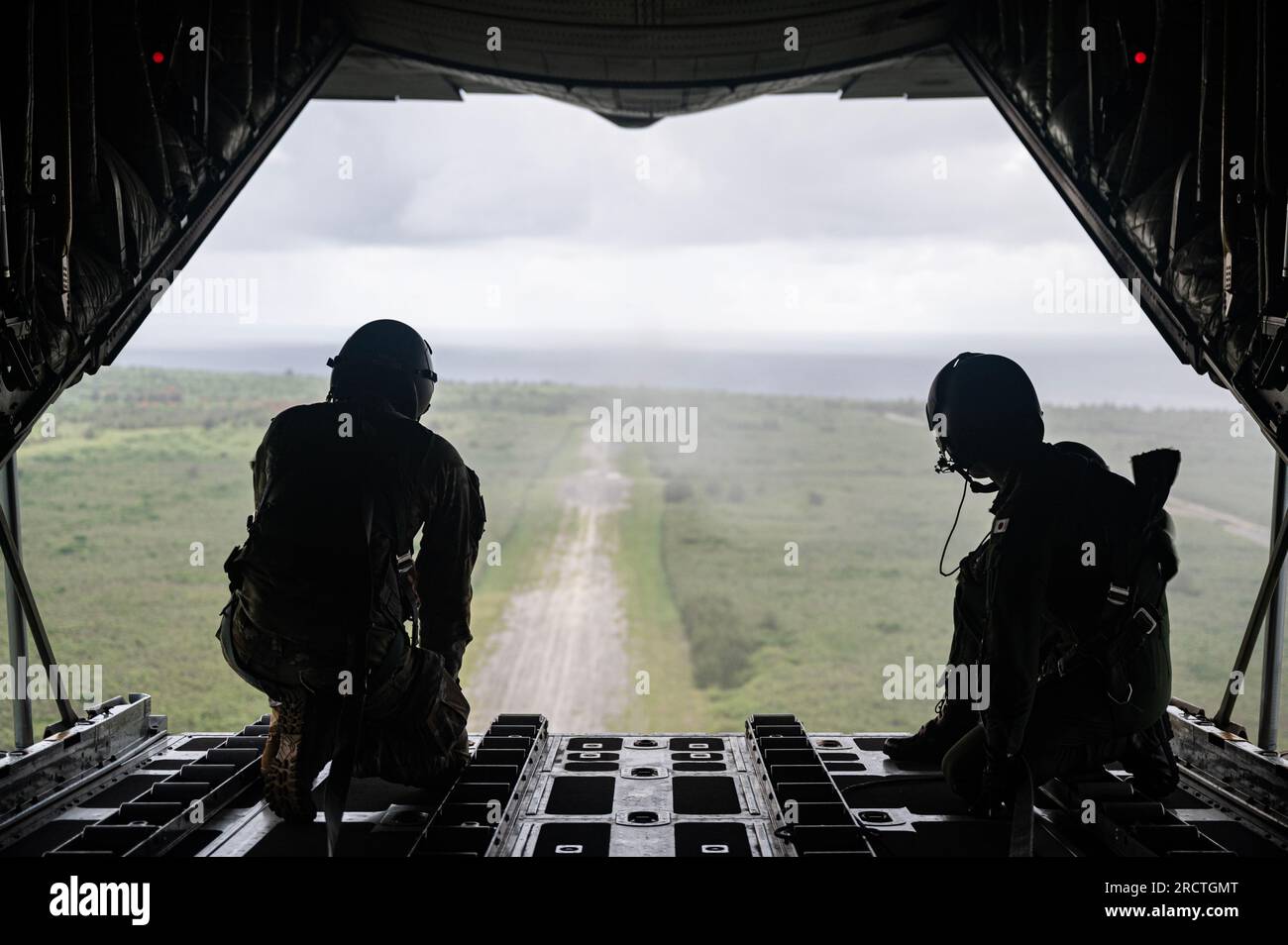 A Japan Air Self-Defense Force C-130H Hercules loadmaster (right ...