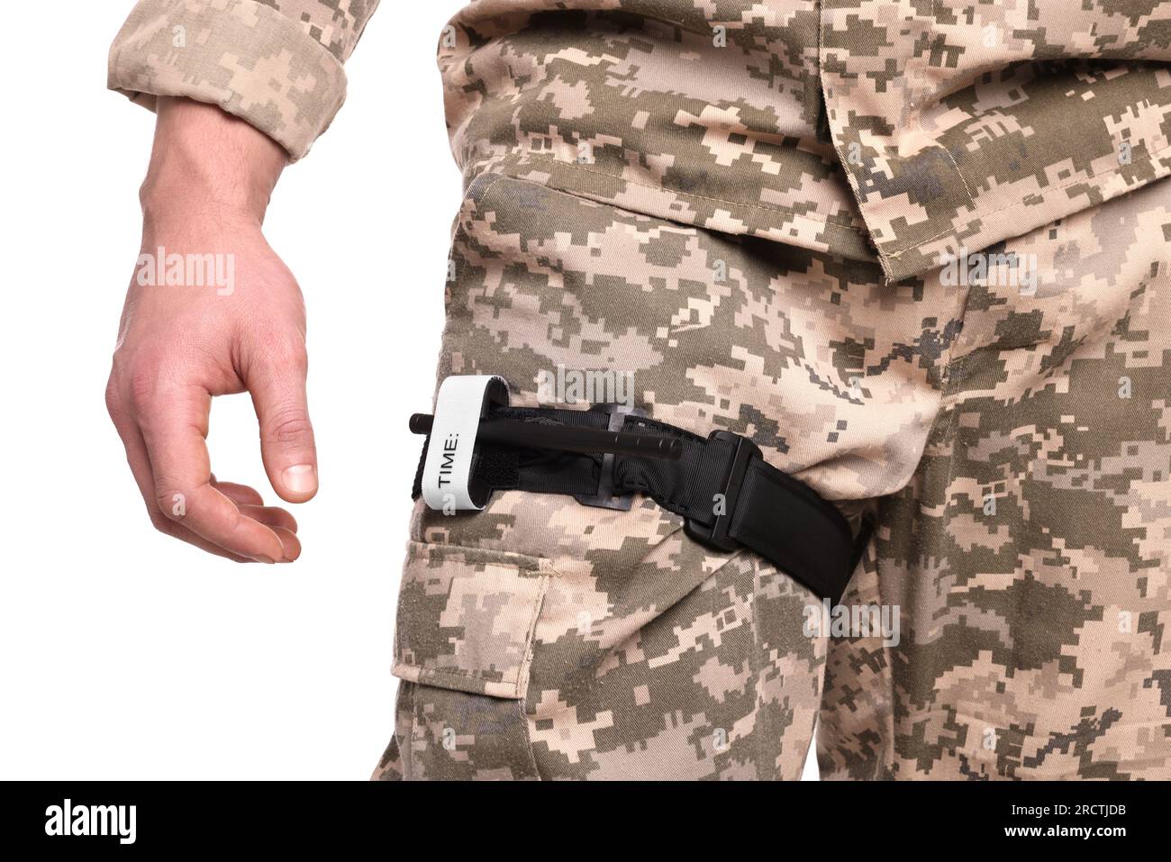 Soldier in military uniform with medical tourniquet on leg against ...