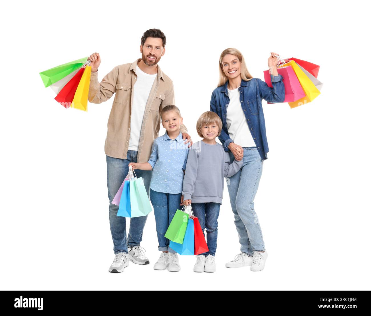 Family shopping. Happy parents and children with many colorful bags on ...