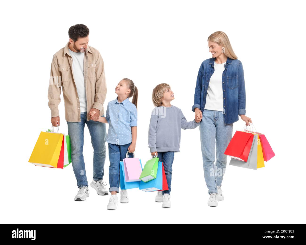 Family shopping. Happy parents and children with many colorful bags on ...