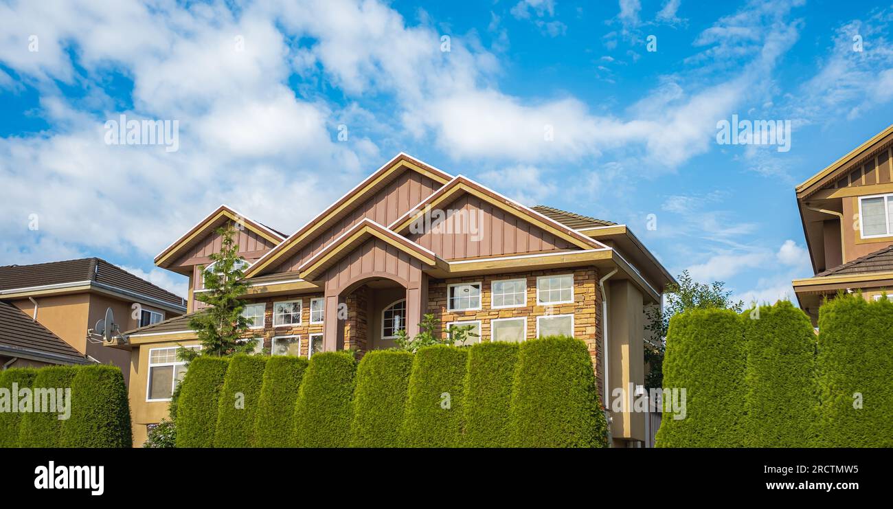 Real Estate Exterior Front House on a sunny day. Big custom made luxury ...