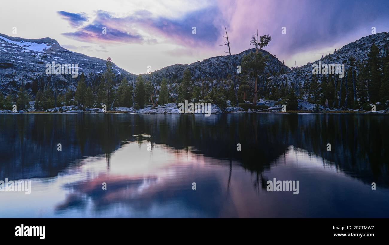 Alpine mountains and it's reflections in the lake at dusk Stock Photo ...