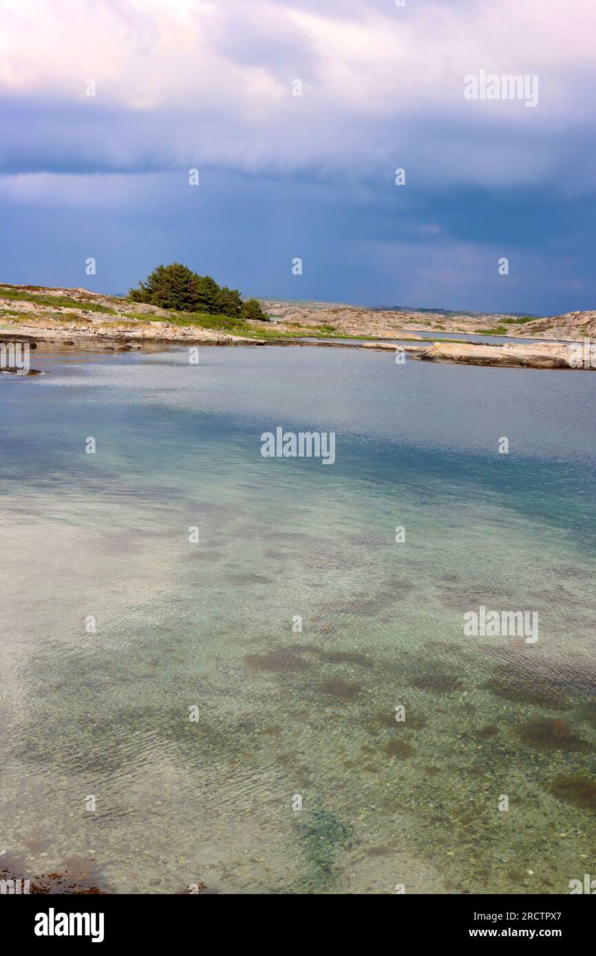 Reflections of clouds in a bay in Fjällbacka archipelago on the western coastline of Sweden ...