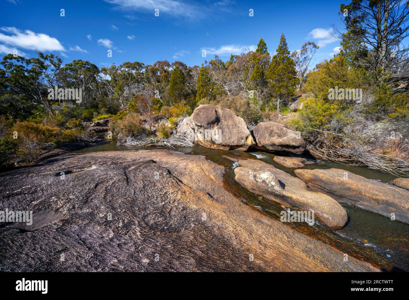 Water cascading over granite rock bed, Bald Rock Creek, Girraween ...