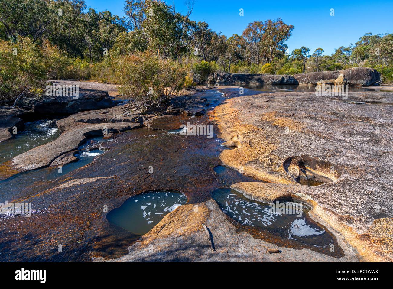 Water cascading over granite rock bed, Bald Rock Creek, Girraween ...