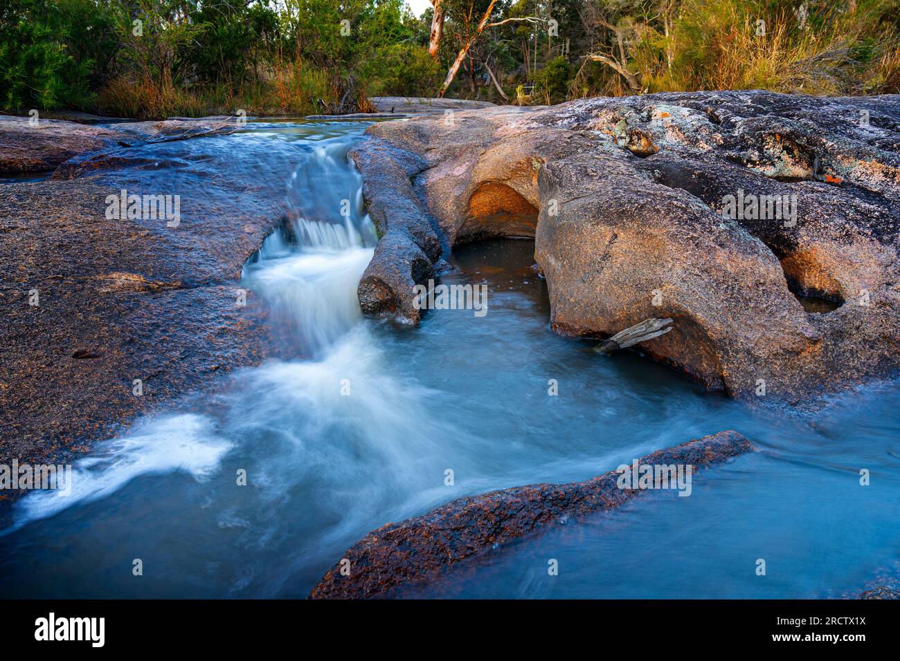Water cascading over granite rock bed, Bald Rock Creek, Girraween ...