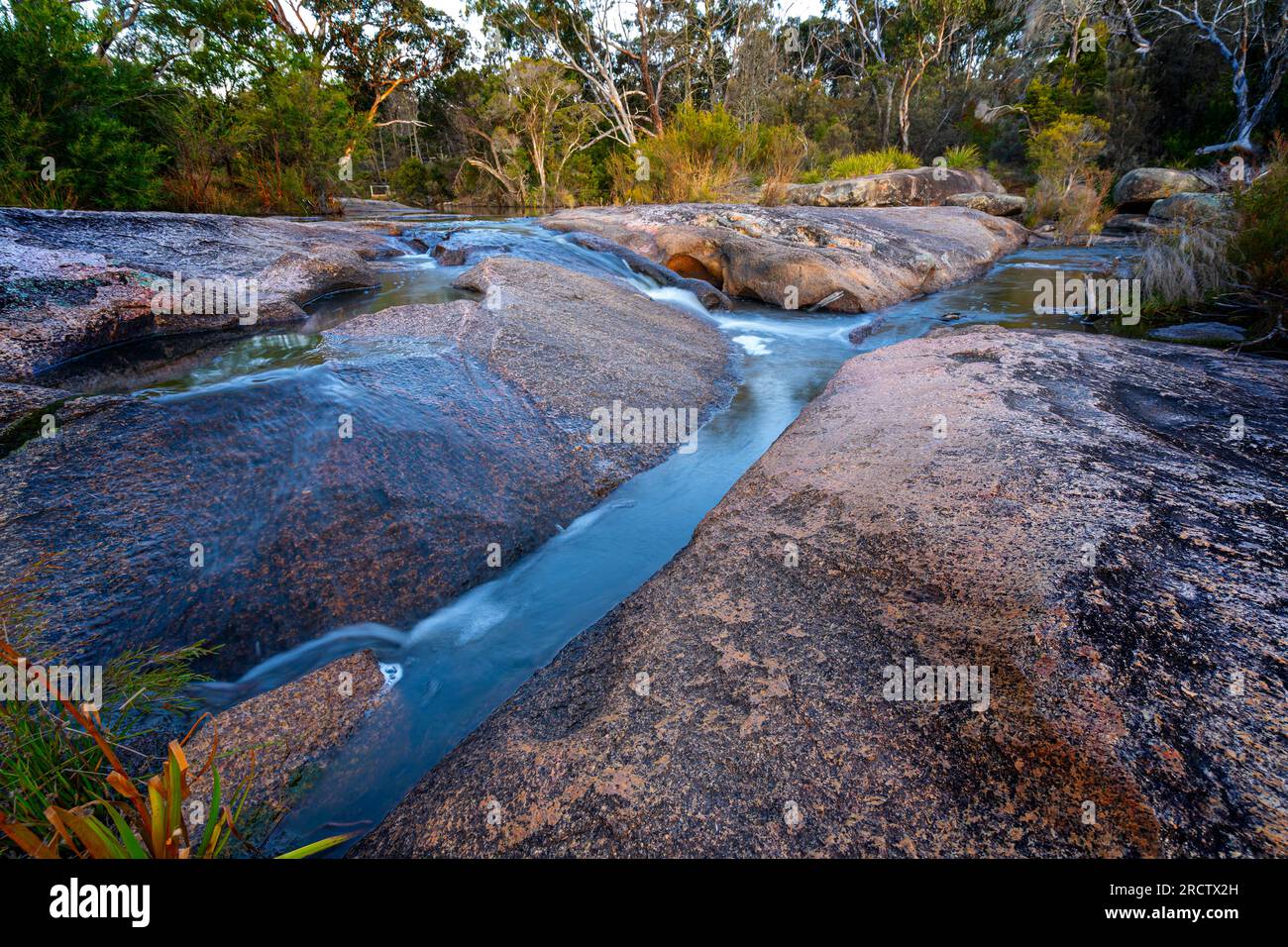 Water cascading over granite rock bed, Bald Rock Creek, Girraween ...