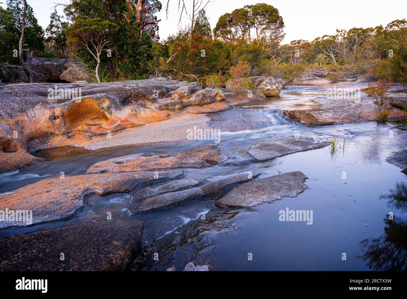 Water cascading over granite rock bed, Bald Rock Creek, Girraween ...
