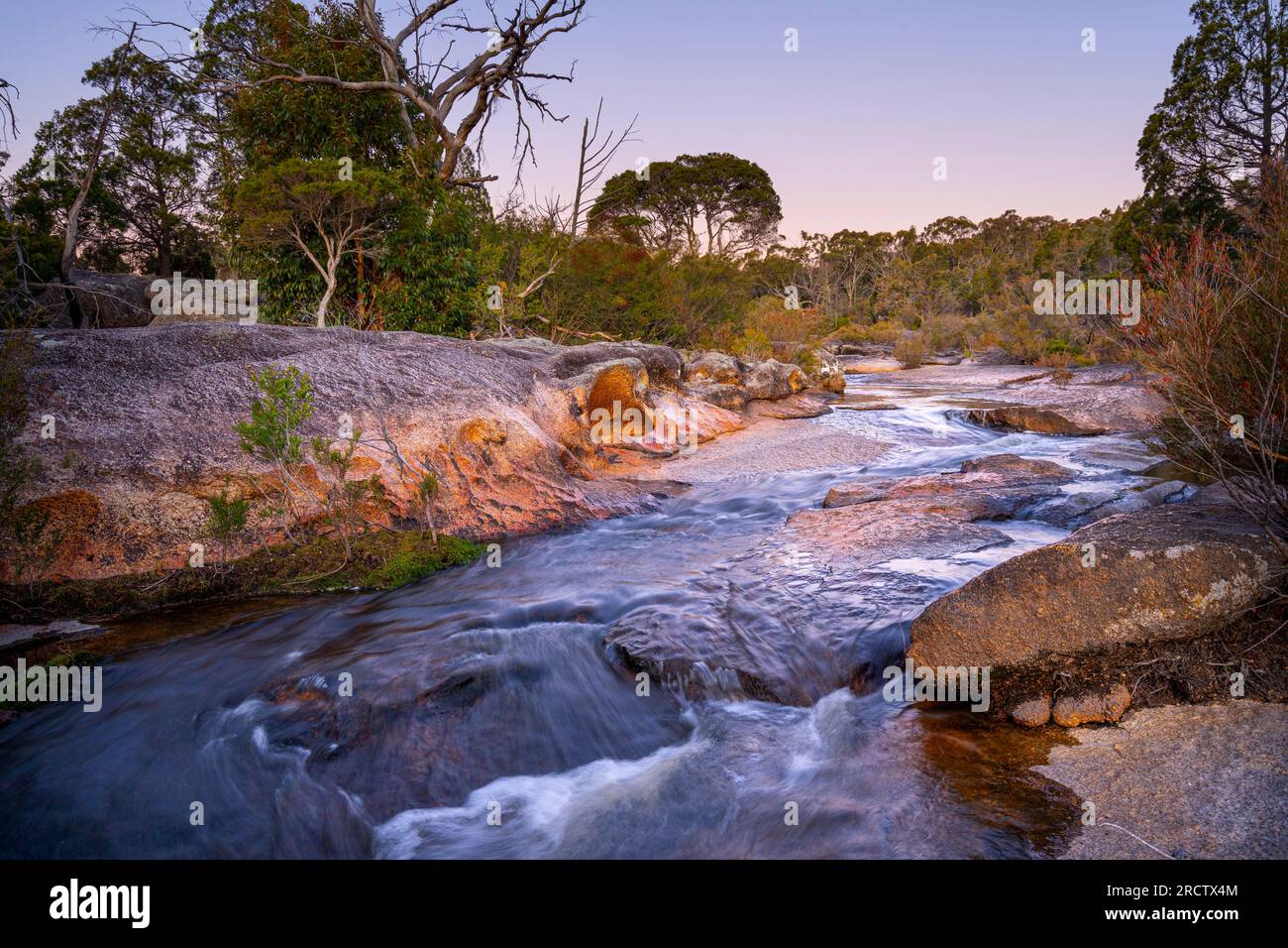 Water cascading over granite rock bed, Bald Rock Creek, Girraween ...