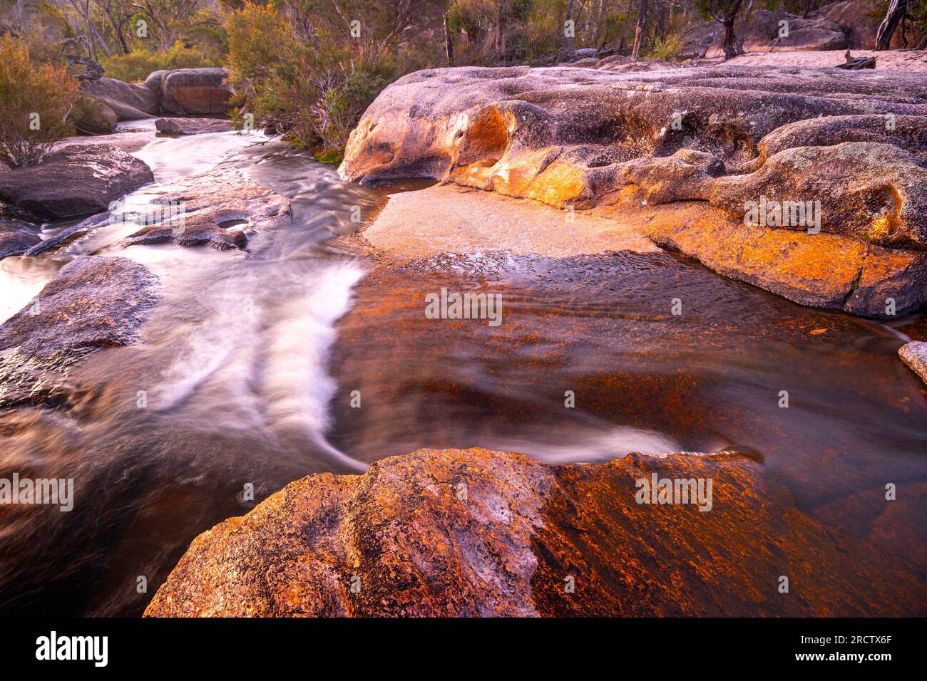 Water cascading over granite rock bed, Bald Rock Creek, Girraween ...