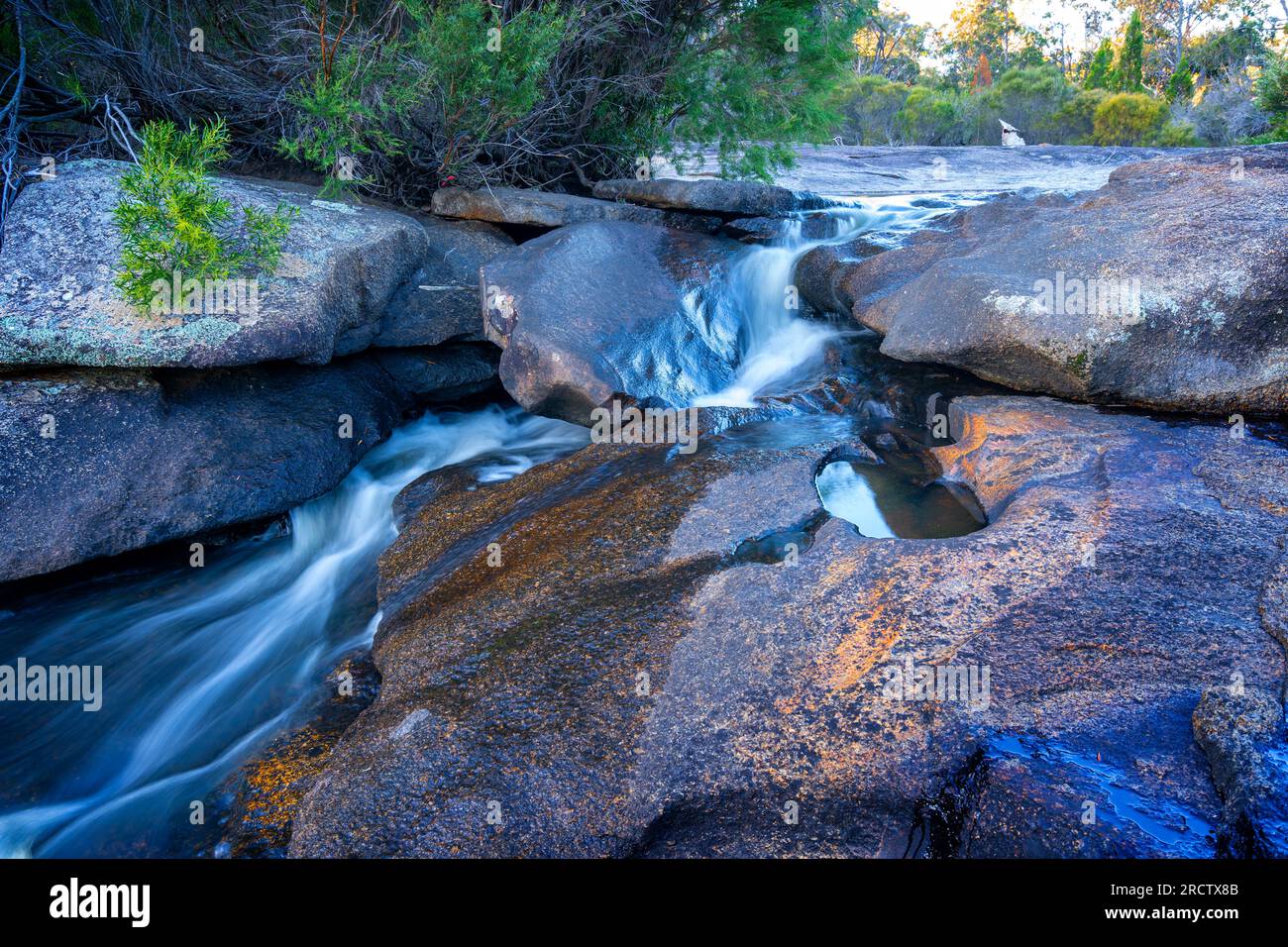 Water cascading over granite rock bed, Bald Rock Creek, Girraween ...