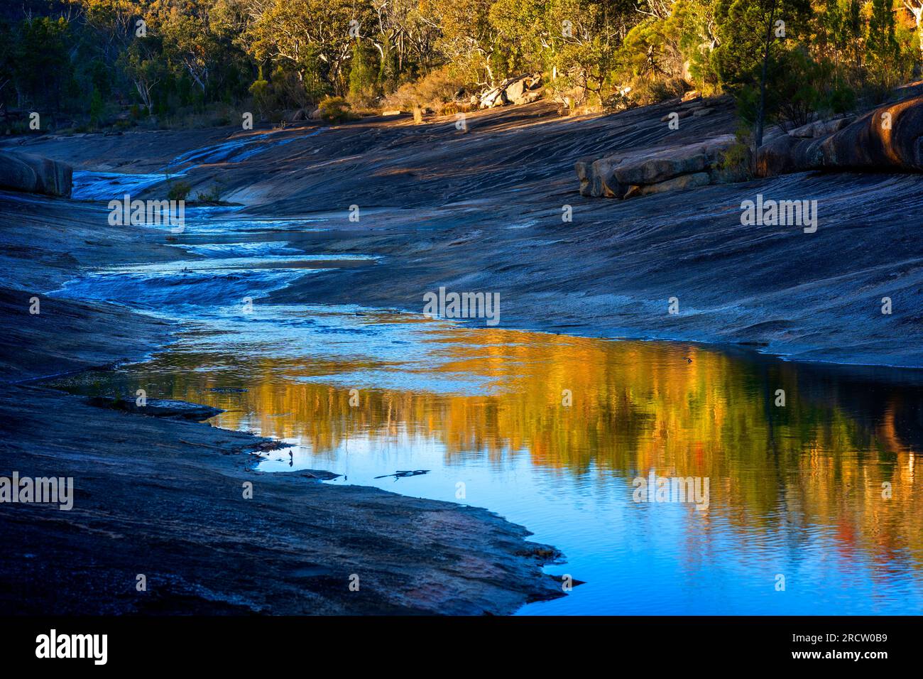 Sunset colours reflected onto waters of Bald Rock Creek, The Junction ...