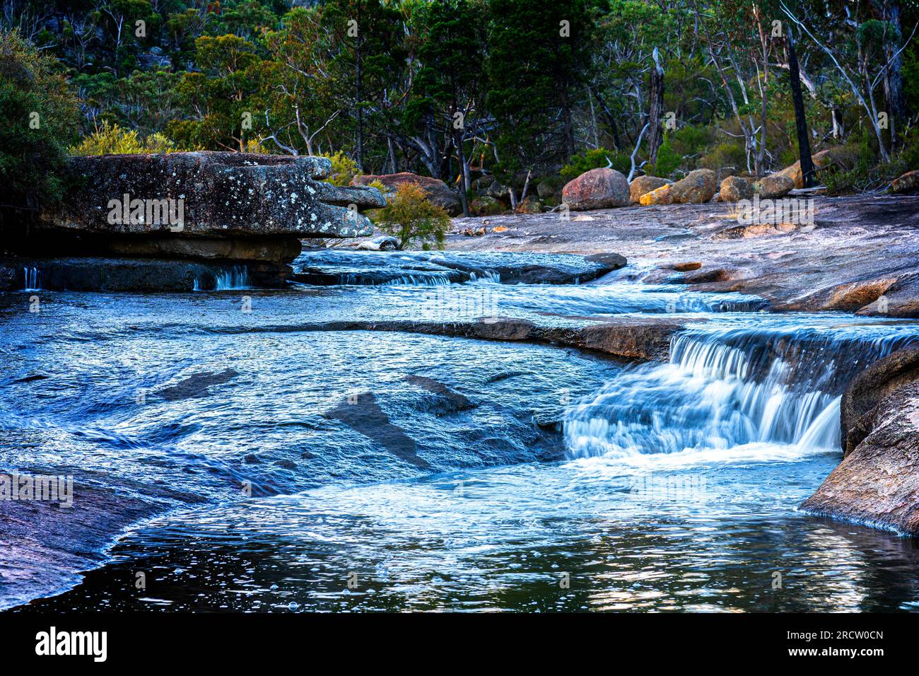 Sunset colours reflected onto waters of Bald Rock Creek, The Junction ...