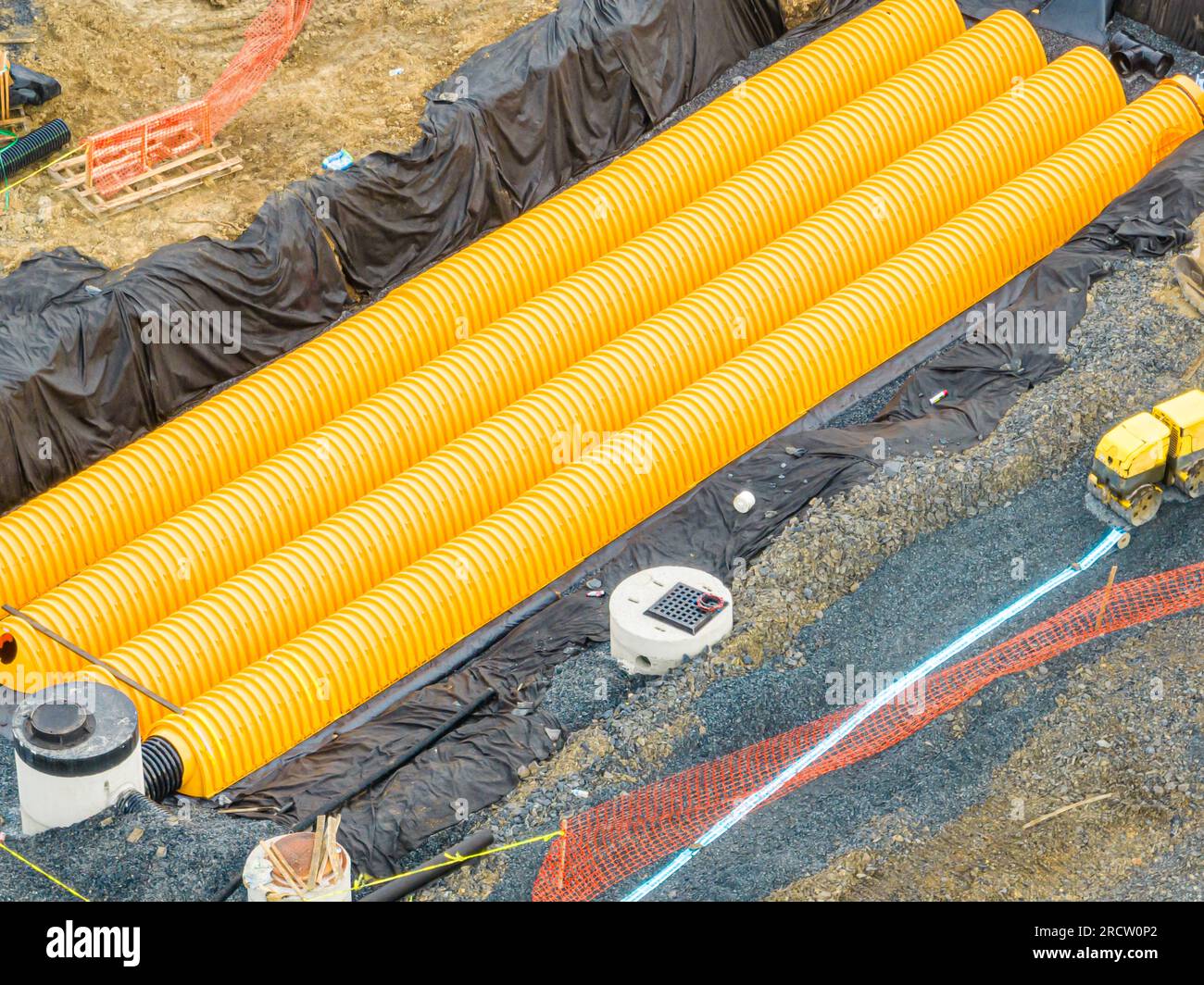Yellow underground storm water detention mitigation units on a ...