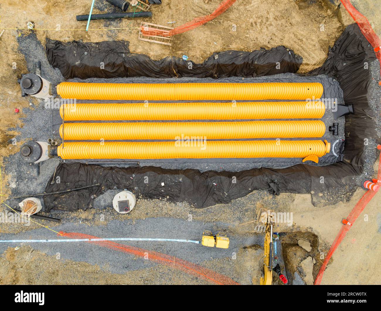 Yellow underground storm water detention mitigation units on a ...